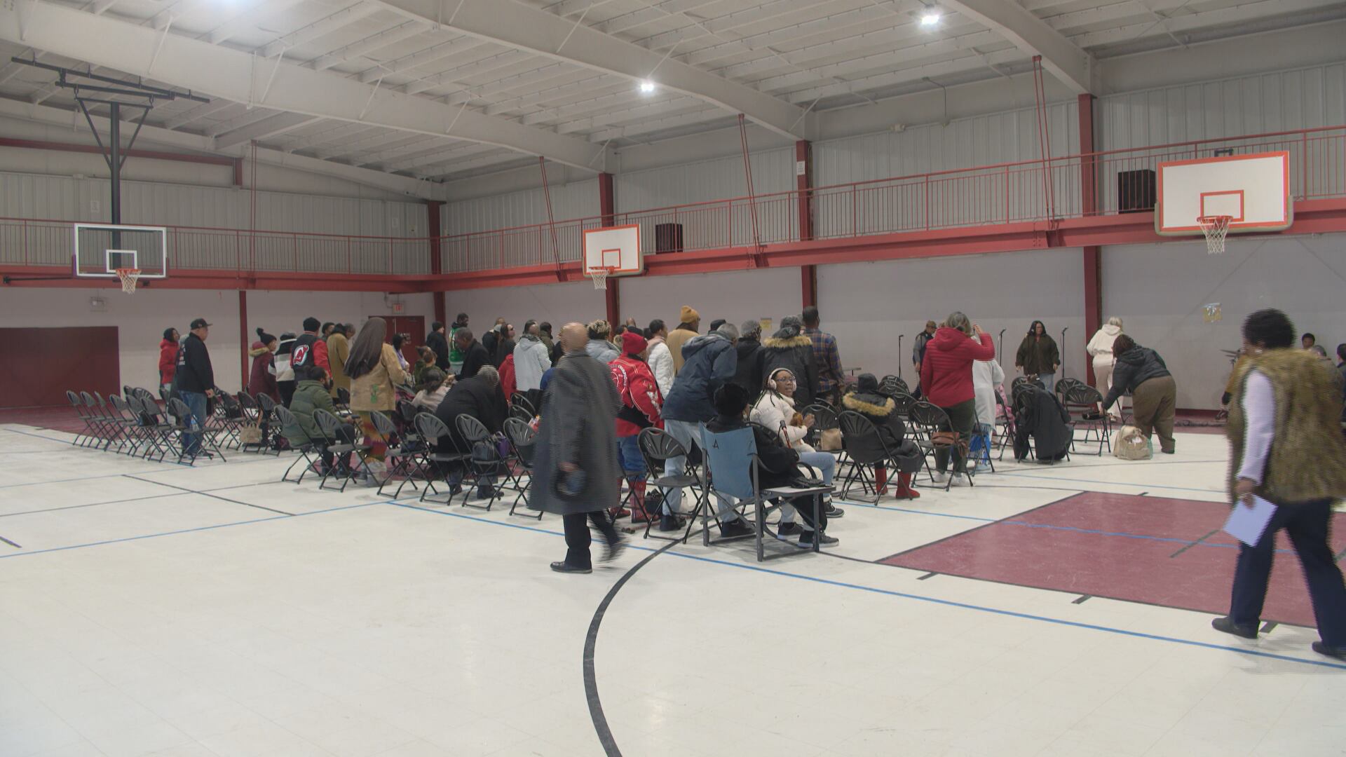 Church members gather for worship after fire destroys building