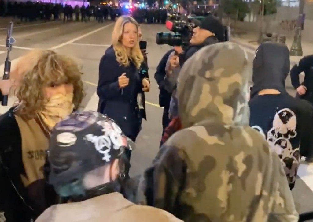 Masked agitators mob female reporter during DTLA anti-ICE protests, try ...