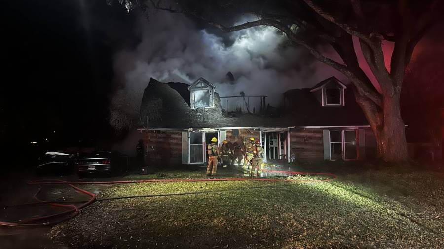 Firefighter hurt as blaze tears through home, garage, vehicles ...