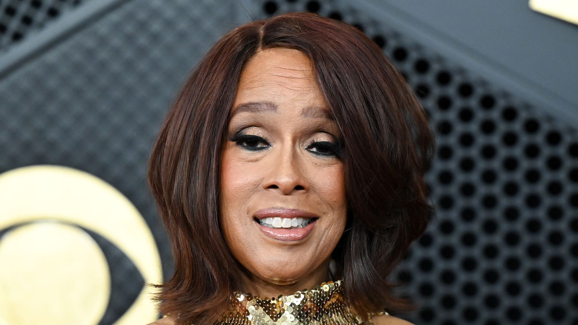 Gayle King showcases svelte figure in gold metallic dress at the 2026 ...
