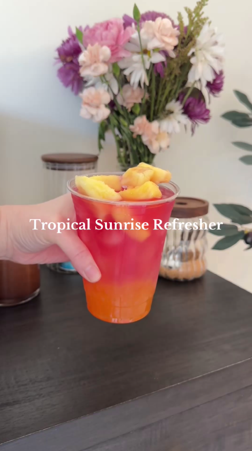 Homemade tropical sunrise refresher with fresh ingredients