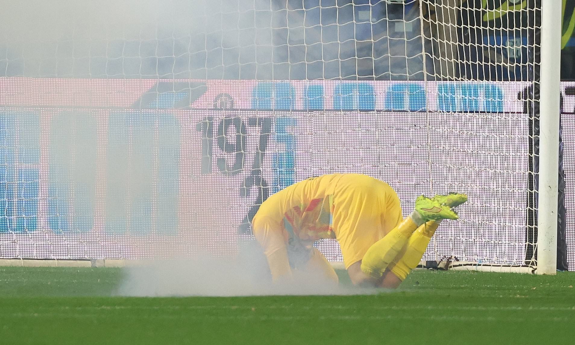 Shocking moment goalkeeper is hit with firework in explosion that also ...