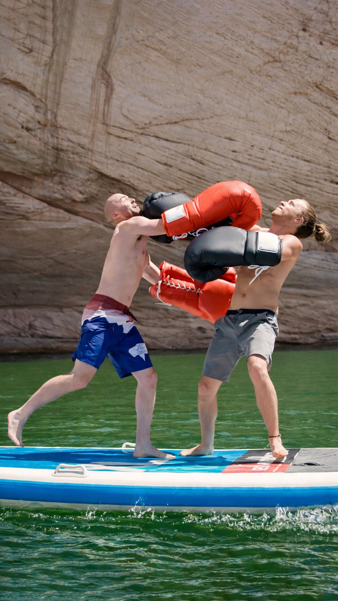 Giant glove boxing on a floating board