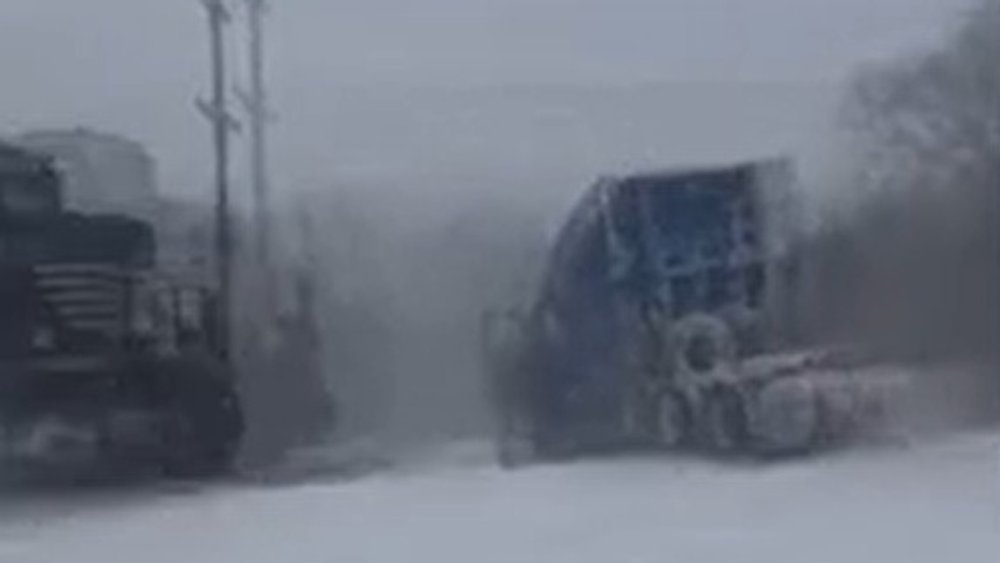 Truck gets stuck on railroad tracks and is hit by freight train