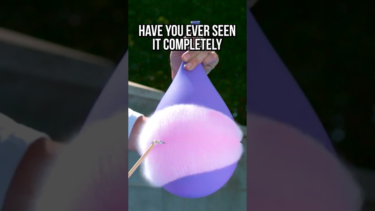 Slow-motion capture of a water balloon popping dramatically