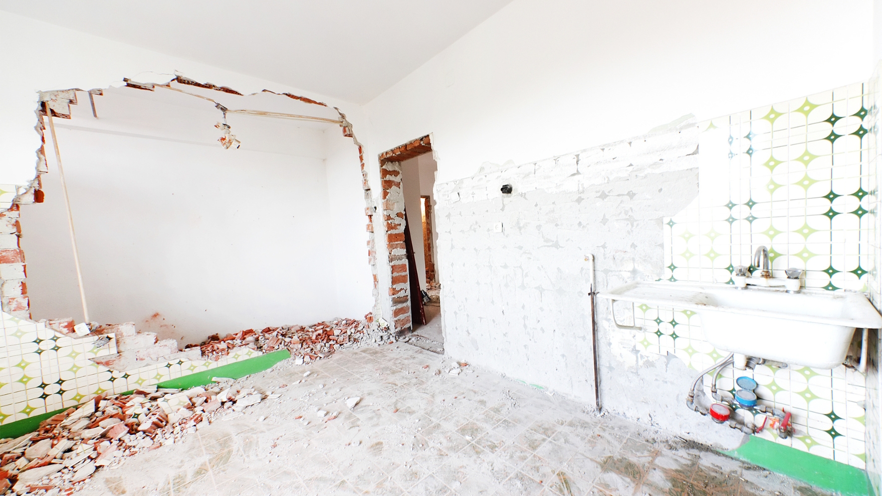 Why opening a wall can trigger upgrade requirements you didn’t plan for