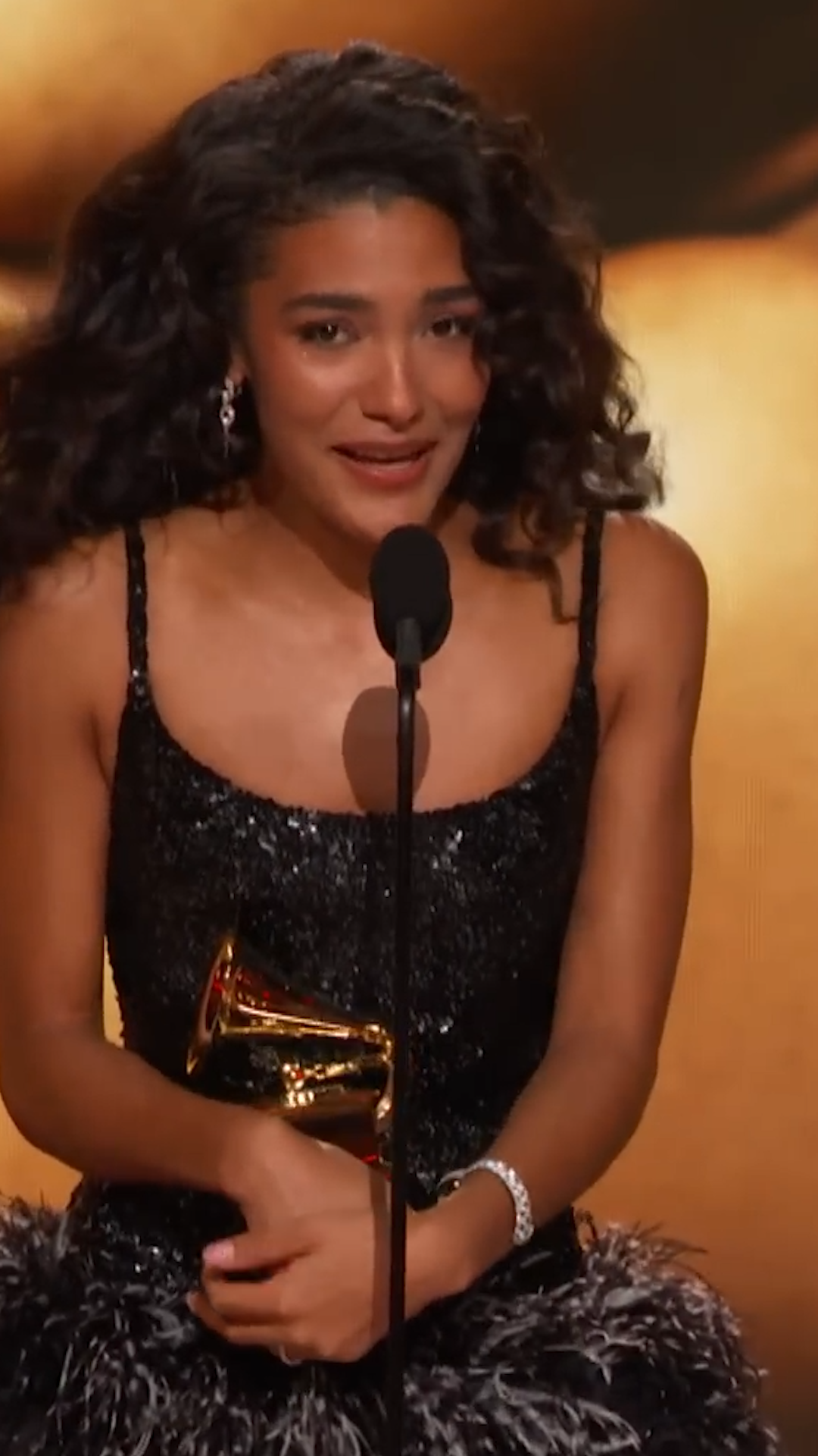Olivia Dean gets emotional accepting her first Grammy for best new artist