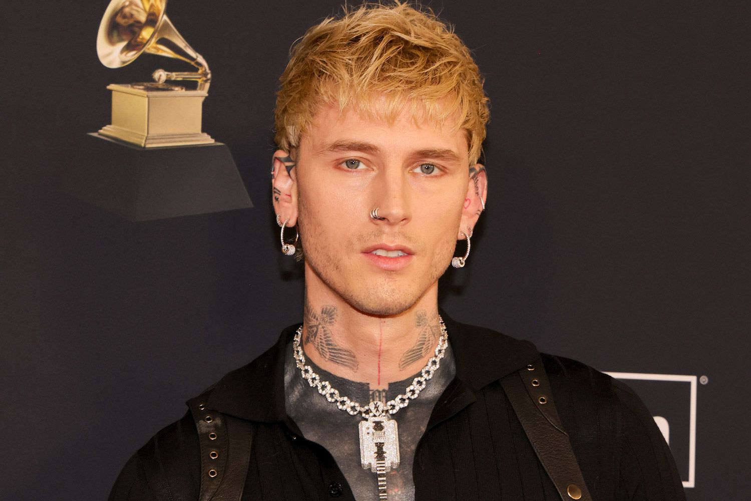 MGK debuts new ear tattoos at 2026 Grammys pre-party