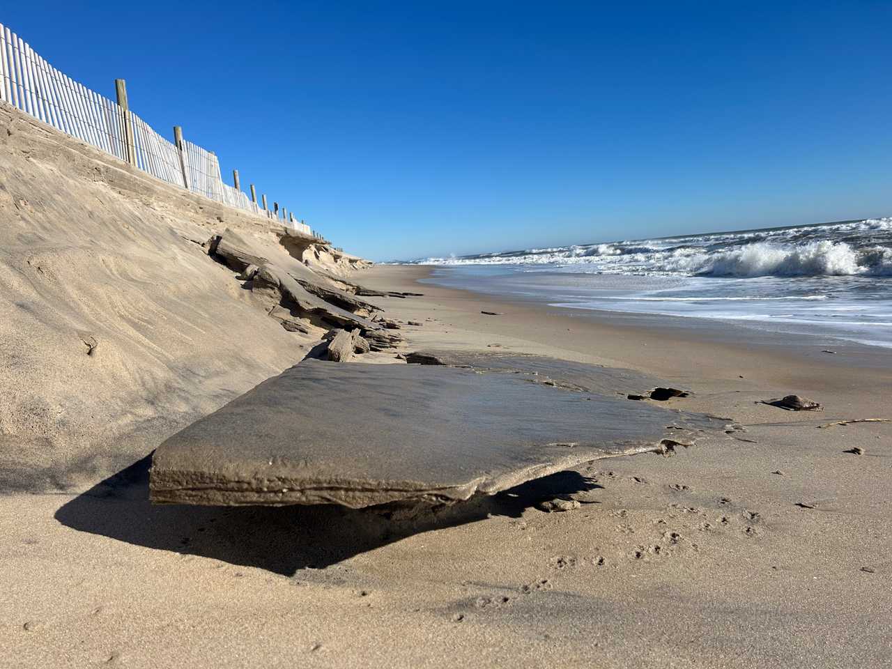 Maryland storm turns Assateague Beach into frozen cliffs and crumbling ...