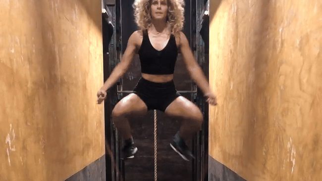 Woman jumps rope in intense 'Spider Wall' workout