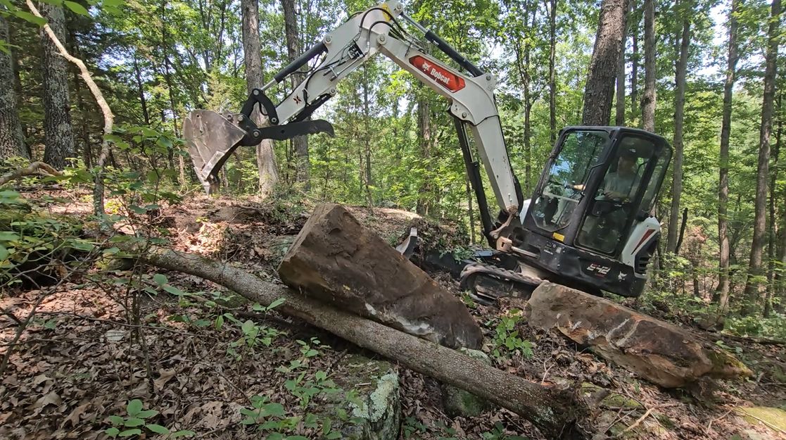 Mini excavator conquers a massive Missouri Ozarks rock ledge