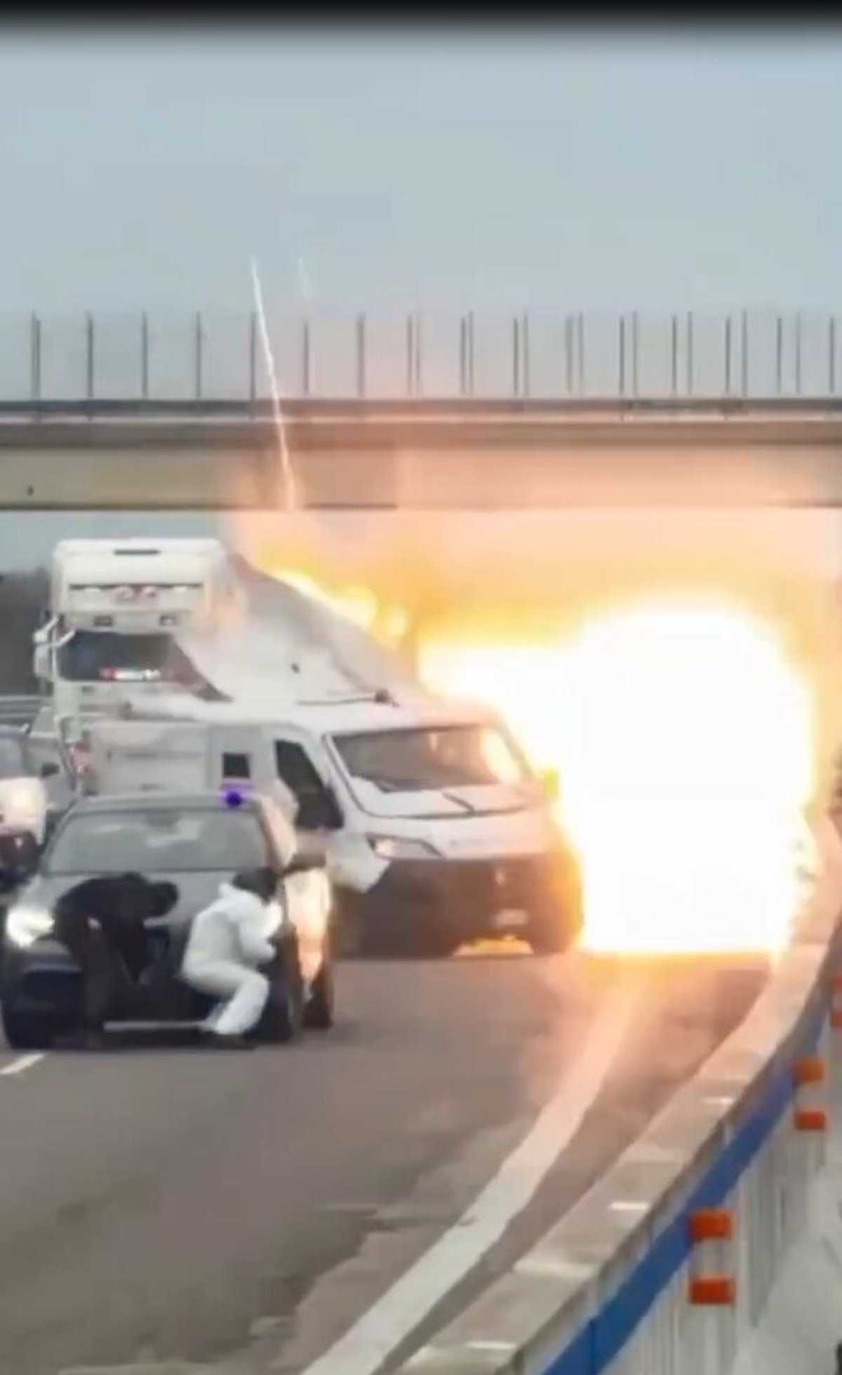 Shocking moment armed robbers block Italian highway and blow up van