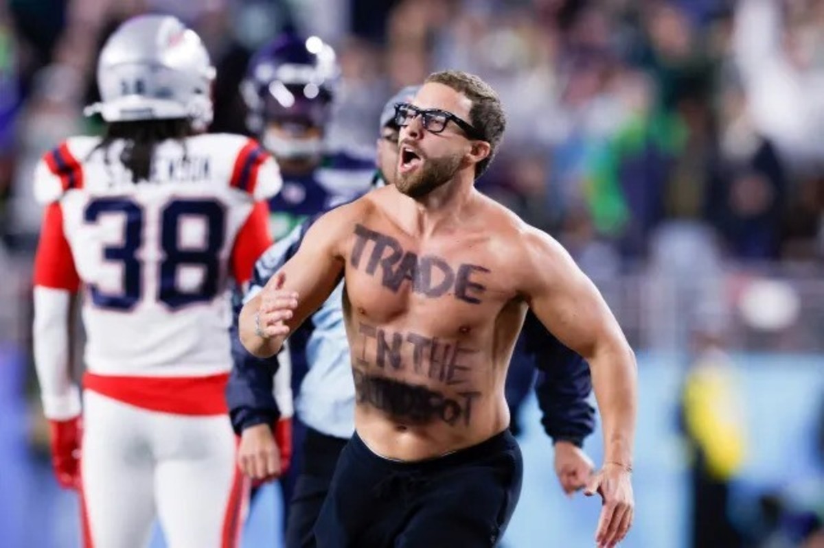 Streaker invades field with cryptic message at Super Bowl LX