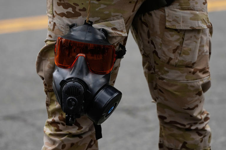 Masks emerge as symbol of Trump's ICE crackdown and a flashpoint in ...