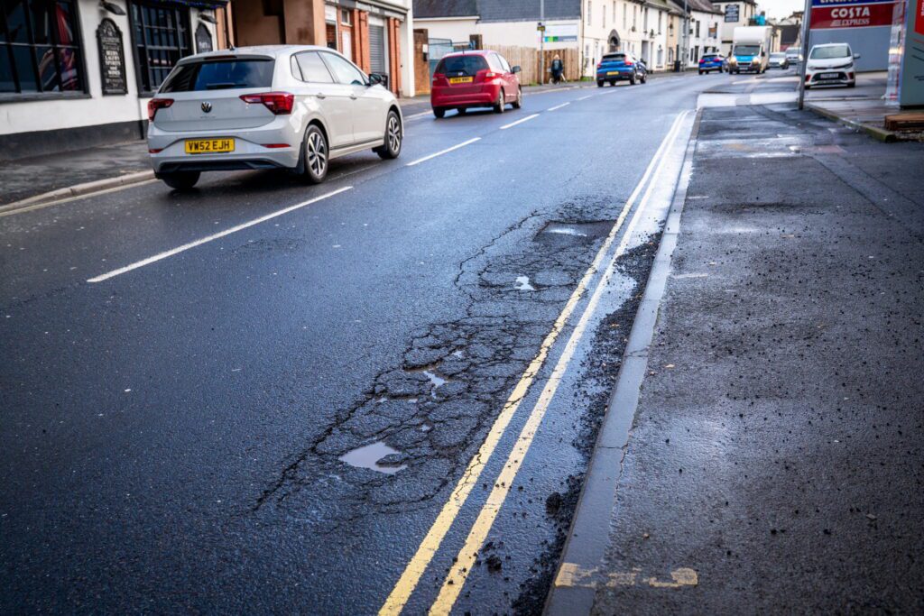 Residents frustrated as over 50 potholes appear in busy street after storms