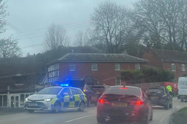 Driver taken to hospital after car comes off road in village