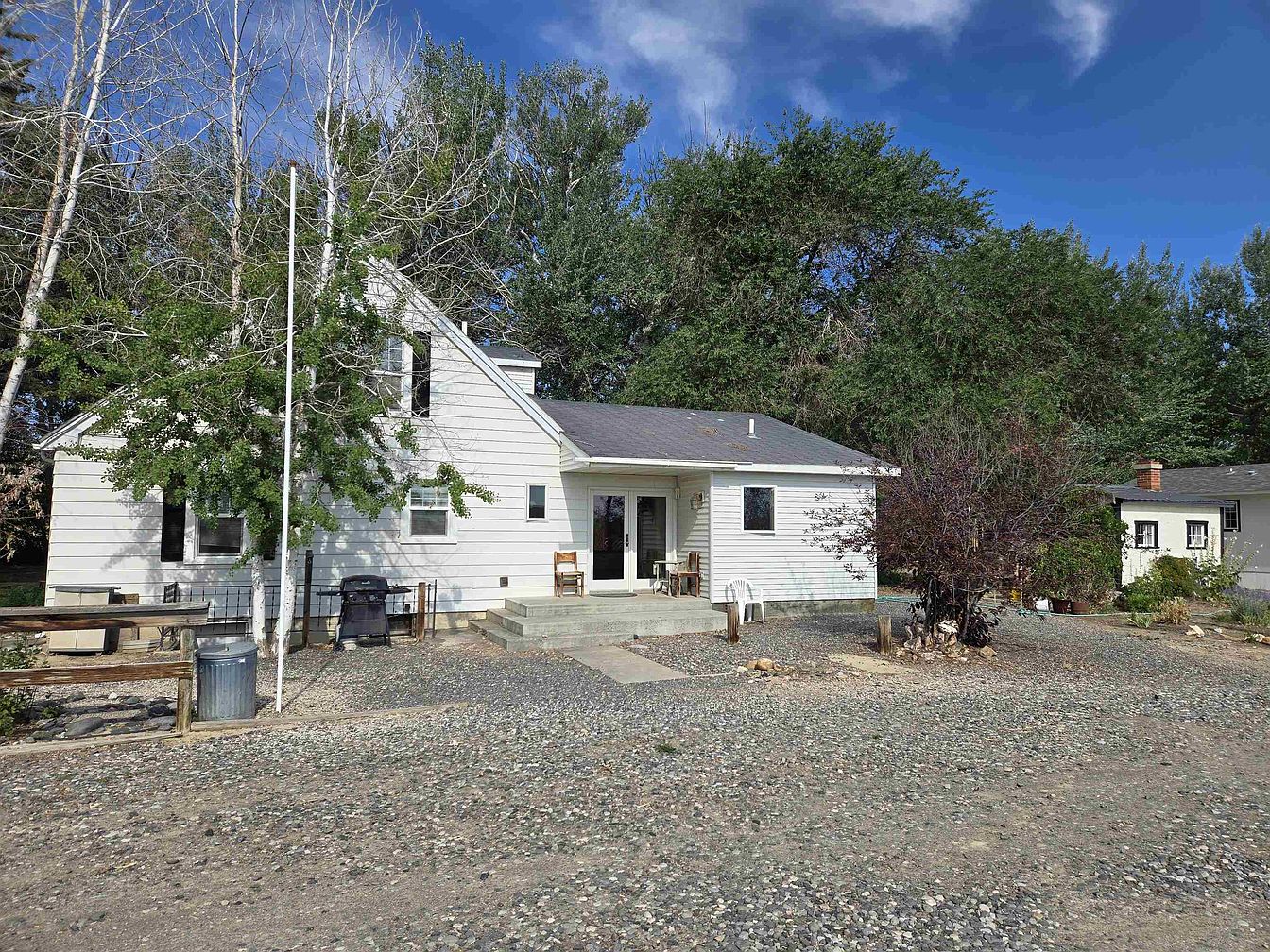 Discover a 1910 farmhouse in Powell, Wyoming, surrounded by mature ...