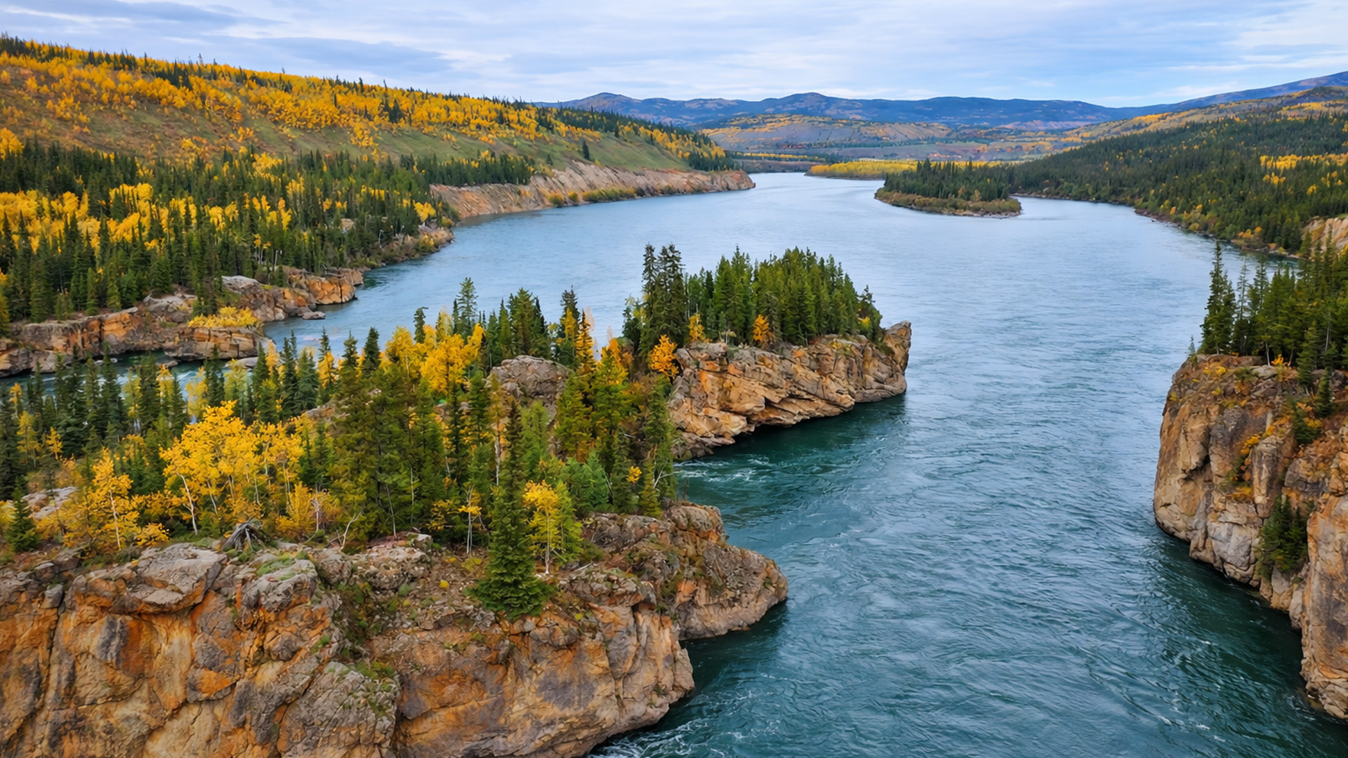 Autumn colors flow through Five Finger Rapids Yukon River