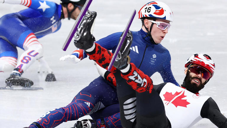 Pupils watch as speed skater crashes at Olympics