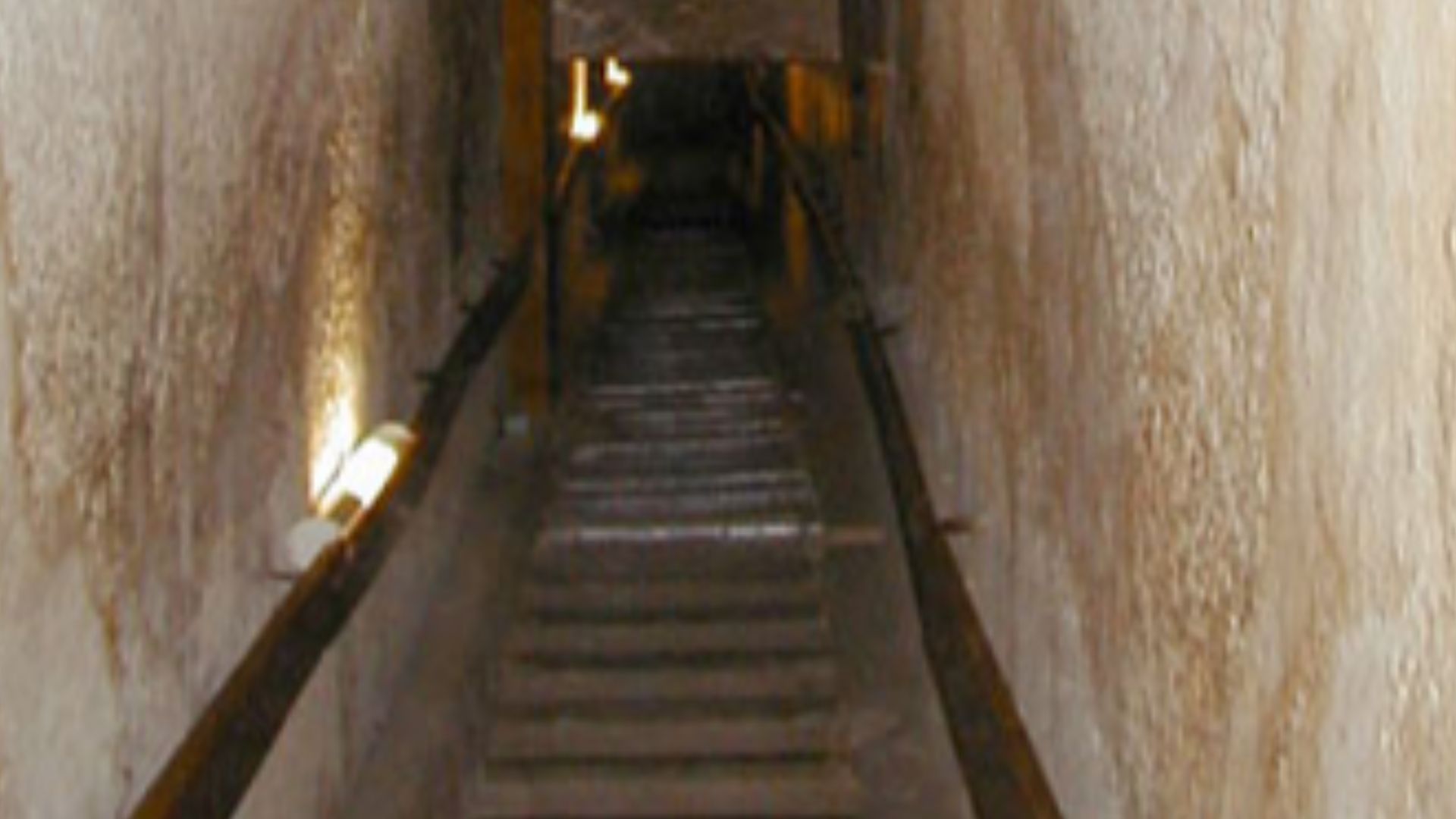 North of Giza, a narrow staircase descends into solid limestone. Long ...