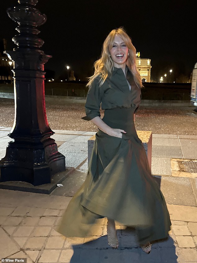 Kylie Minogue stuns in a PVC fringed dress as she presents an award at ...