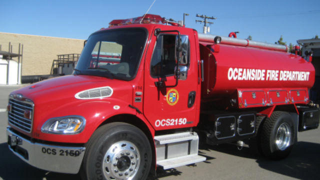 Truck driver rescued after dangling over Oceanside bridge