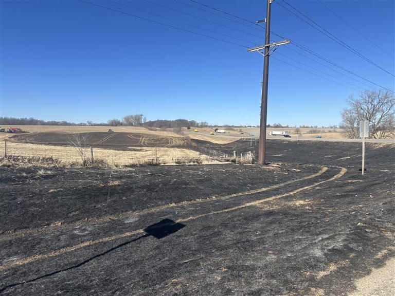 Crews put out field fire off I-80 in Iowa