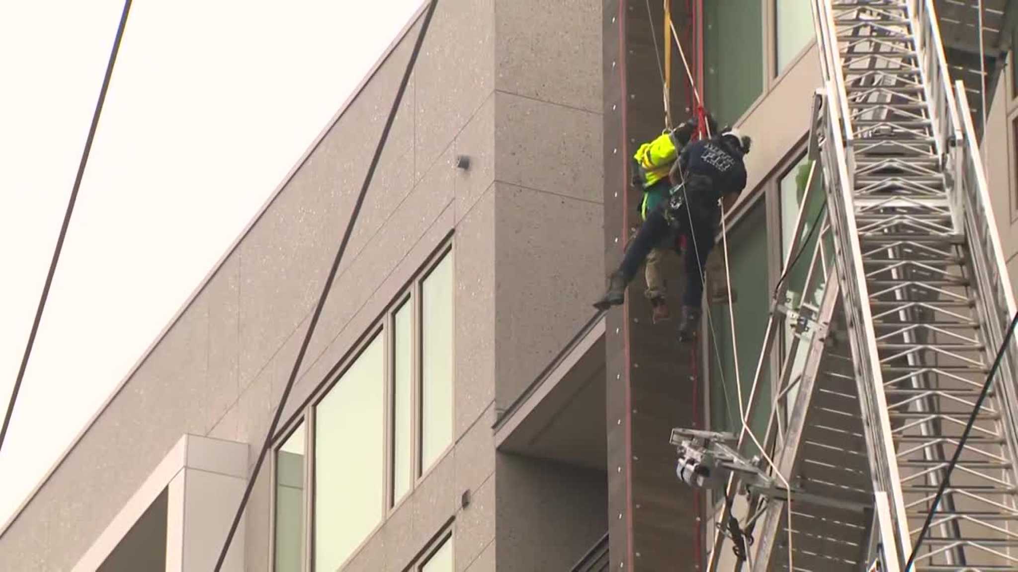 Sacramento crews rescue 2 who were stuck high up on building after ...