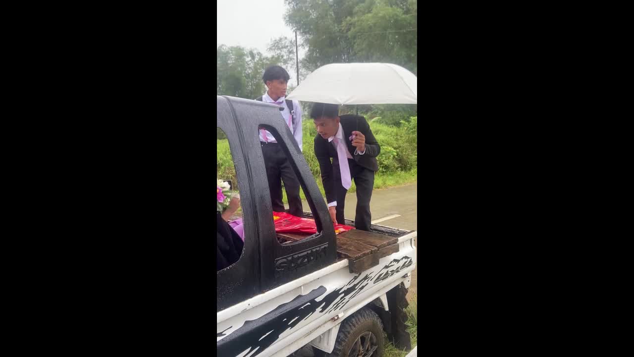 Bride and groom brave storm to push through with very muddy wedding
