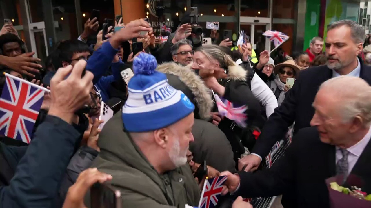 Crowd drowns out protest chants as King visits Barking