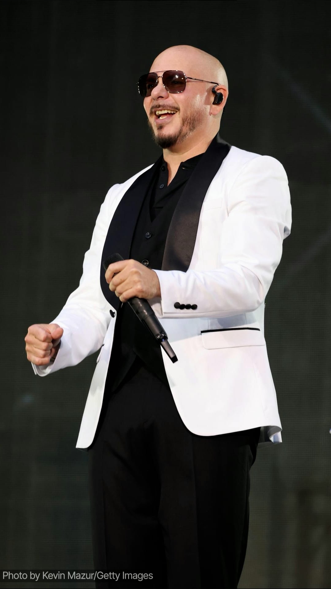 Pitbull targets world record for most people wearing bald caps