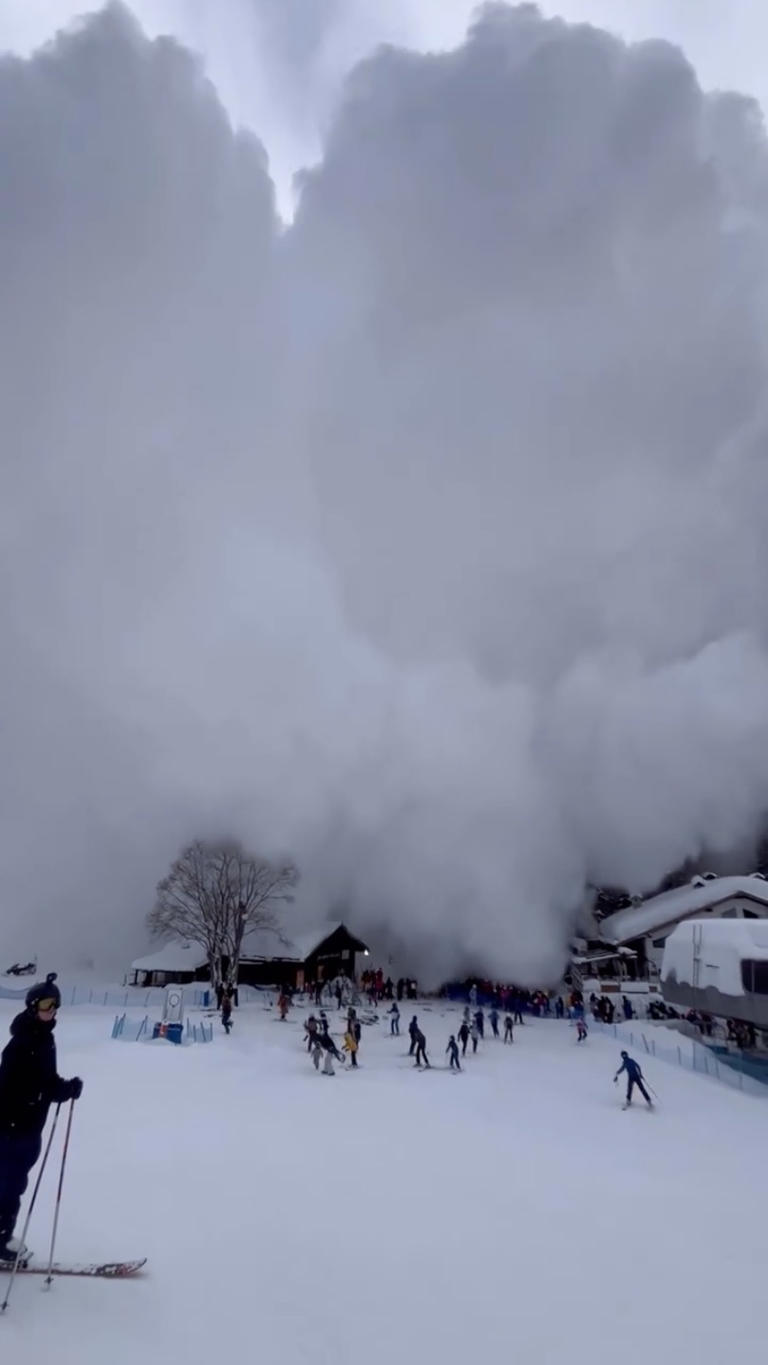 Wild video shows avalanche spill down mountainside, engulfing skiers ...