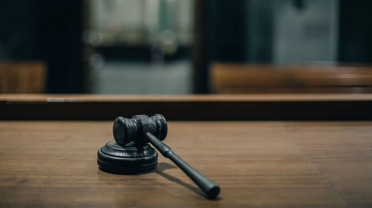 Union faces federal worker’s suit over seized dues