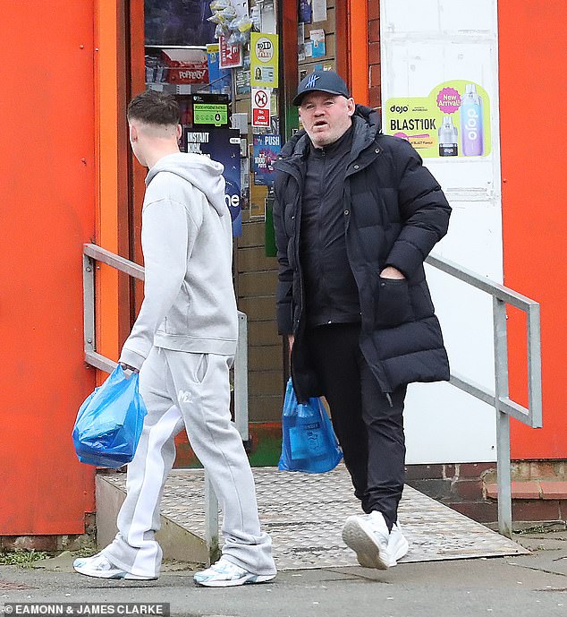 Wayne Rooney steps out of a corner shop with a bag of booze with son Kai