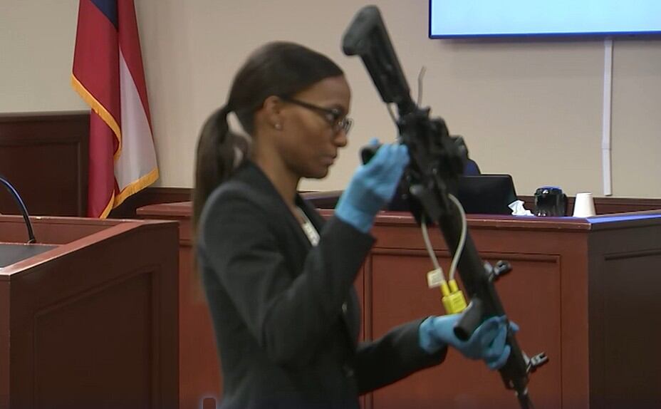 Live: Rifle, crime scene images shown in trial of father of alleged ...
