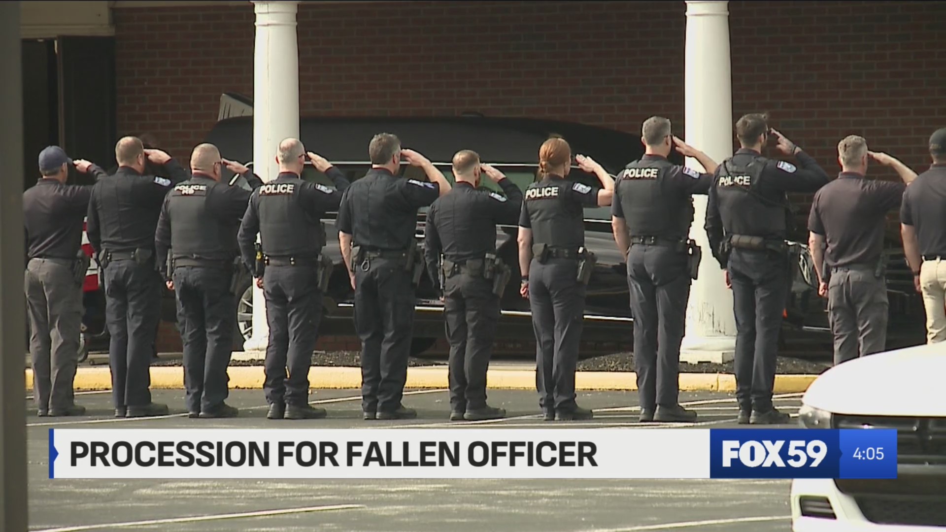 Law enforcement officers pay respect as body of fallen officer Brian ...