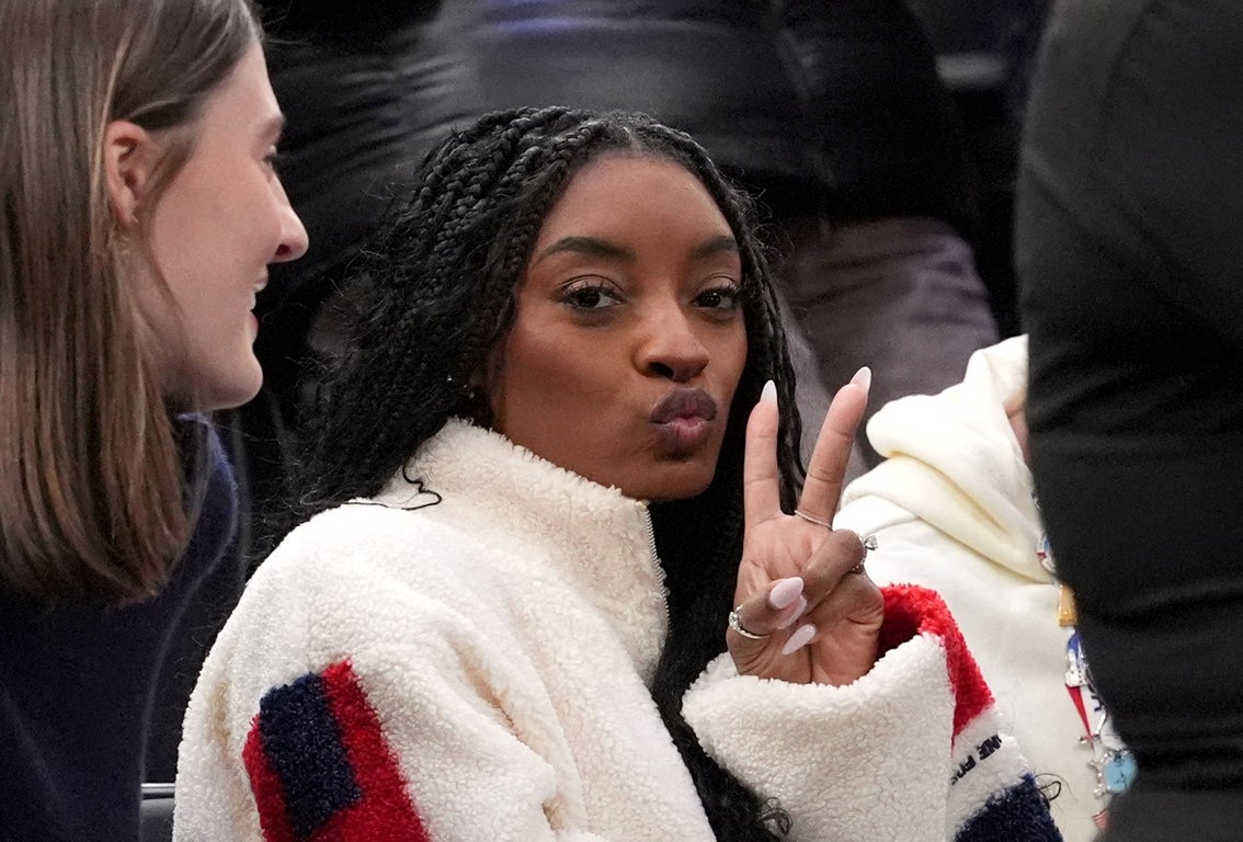 Simone Biles, gymnastics legend and SI swimsuit model, in photos