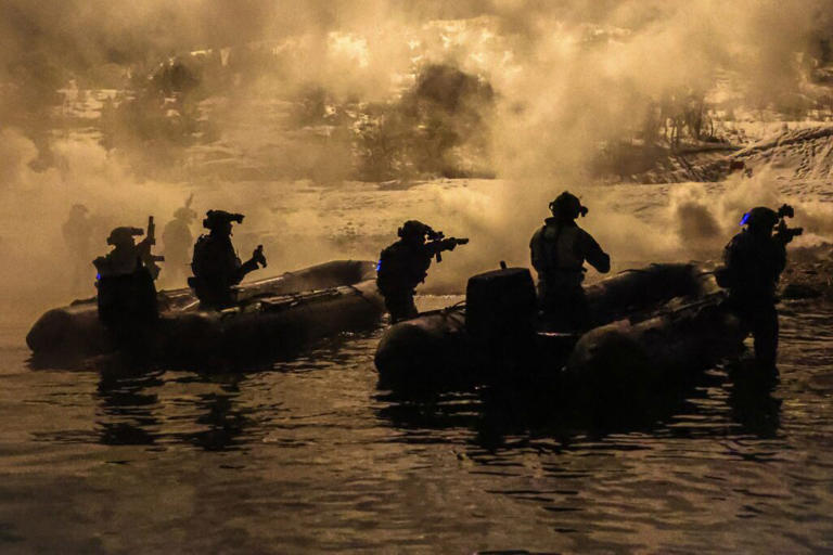 Teeth-chattering scenes as commandos storm beach amidst "rising Russian ...