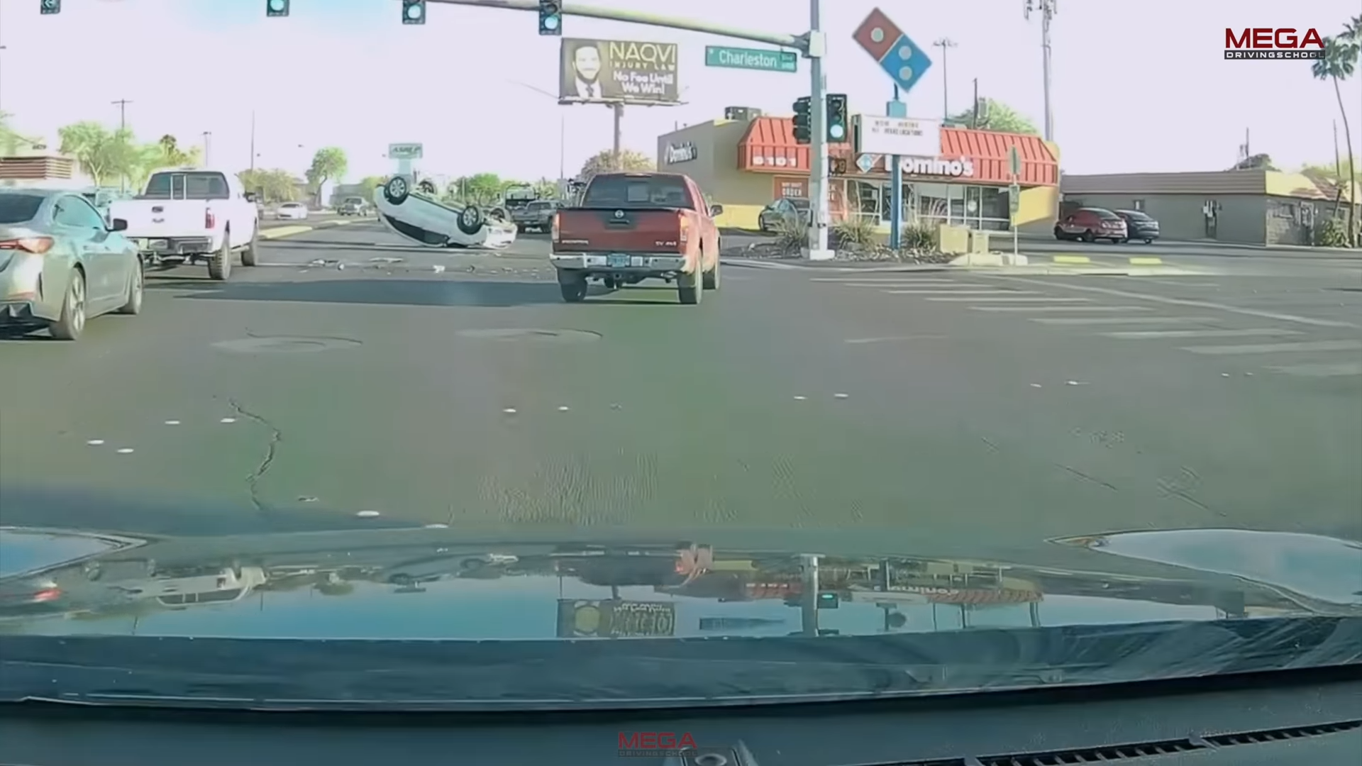 Driver runs a red light on a busy cross section - ends up turned upside ...
