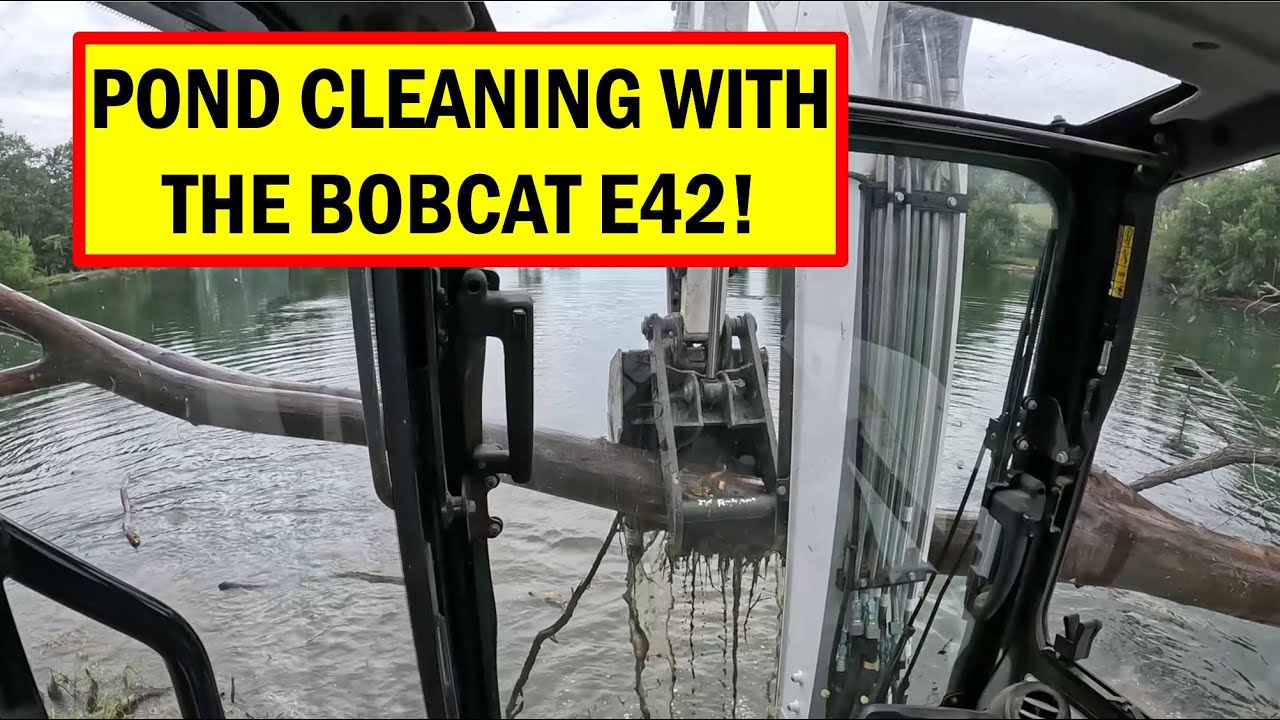 Clearing downed trees in pond with Bobcat E42 R2 series mini excavator