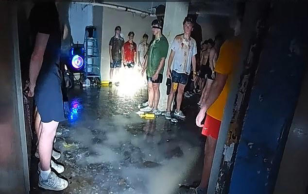 Moment police uncover 56 shirtless, blindfolded young men in frat house ...