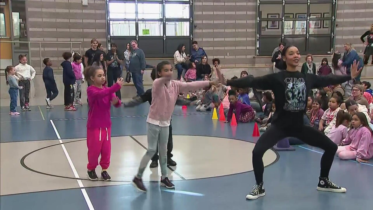 Students dance with Cleo Parker Robinson performers