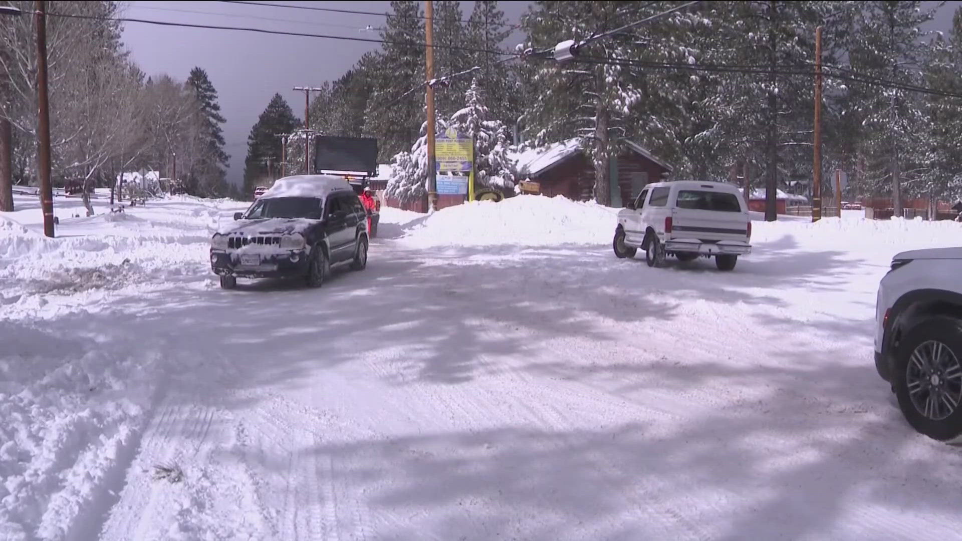 Snow and high winds knock down trees across Big Bear as crews clear roads