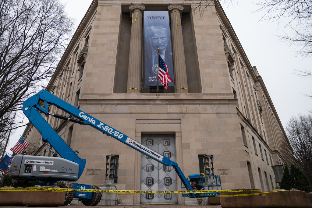 Giant Trump banner hung on Justice Department headquarters