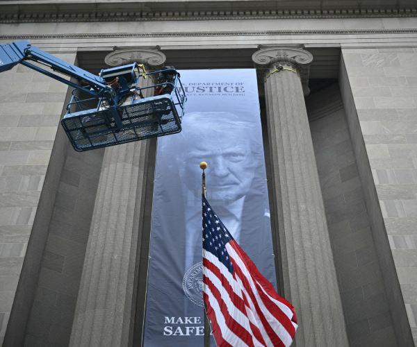 Trump banner hung over Justice Department HQ