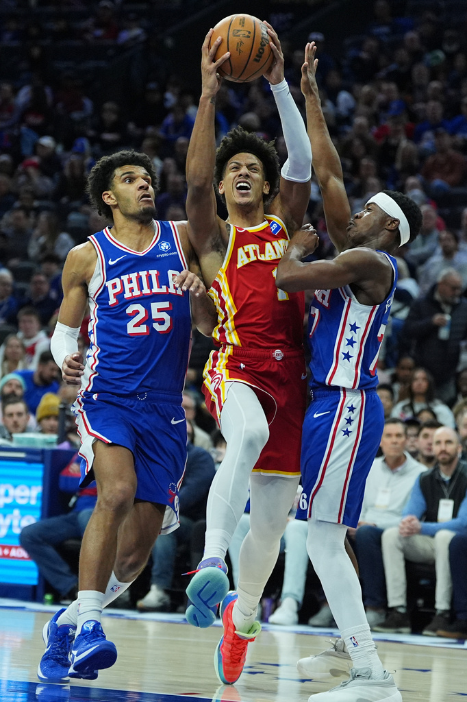Johnson and McCollum power Hawks past the 76ers 117-107 as Atlanta ...