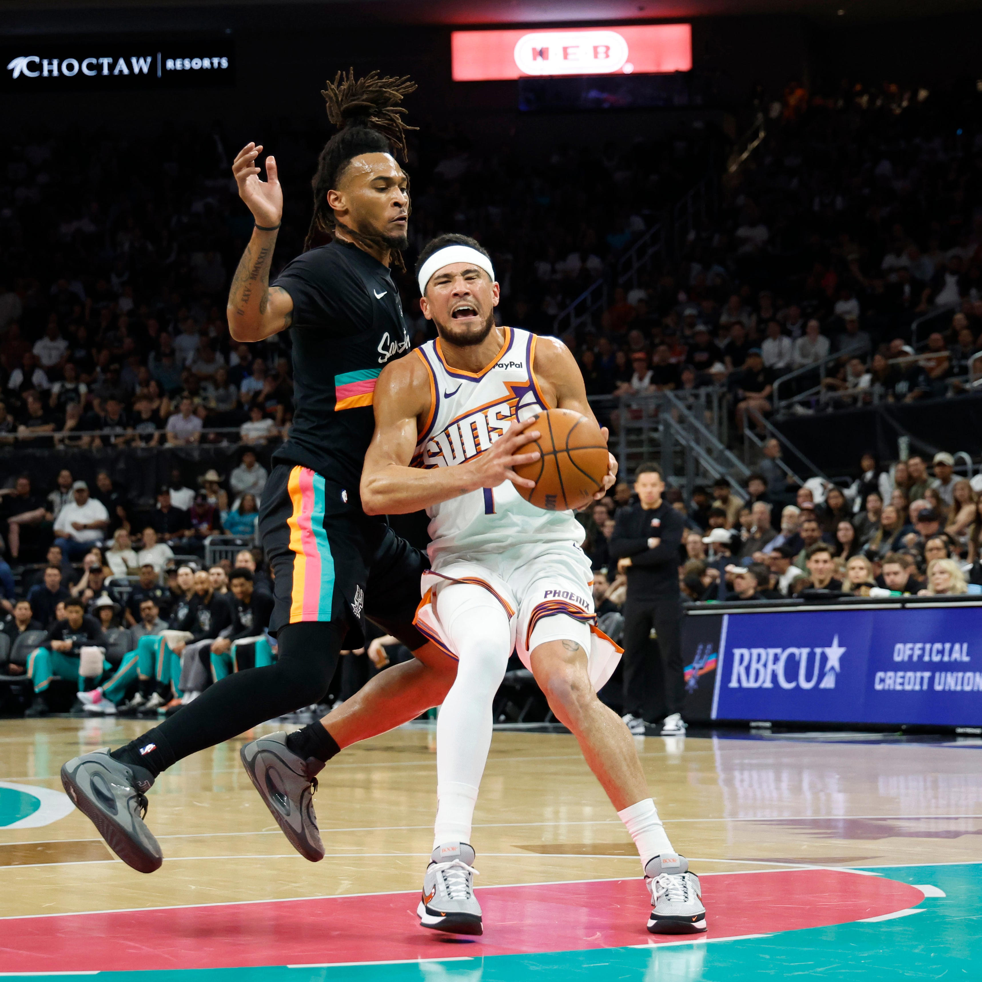 Devin Booker suffers hip injury as Spurs blitz Phoenix Suns