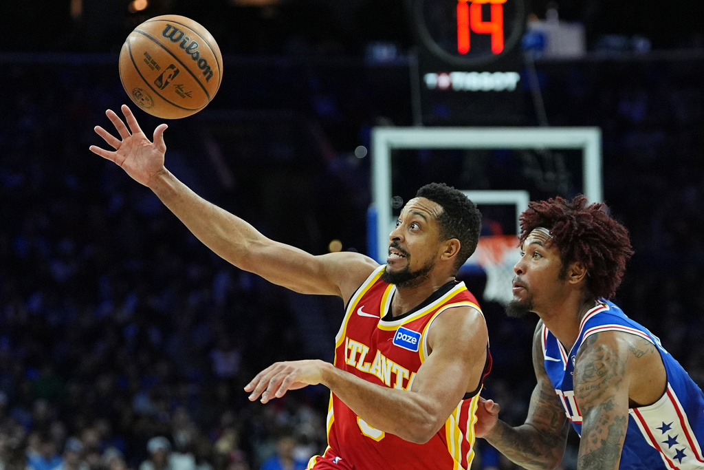 Johnson and McCollum power Hawks past the 76ers 117-107 as Atlanta ...
