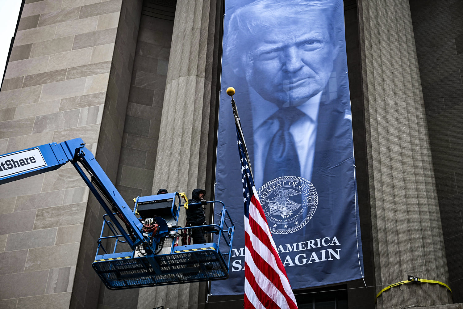 Large banner of Trump unfurled at Justice Department headquarters