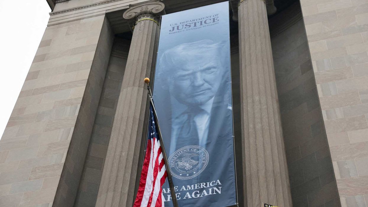Firestorm as DOJ HQ unveils new Trump banner